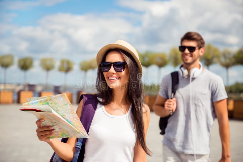 Young Smiling People Searching for Direction Using Paper Map Stock ...