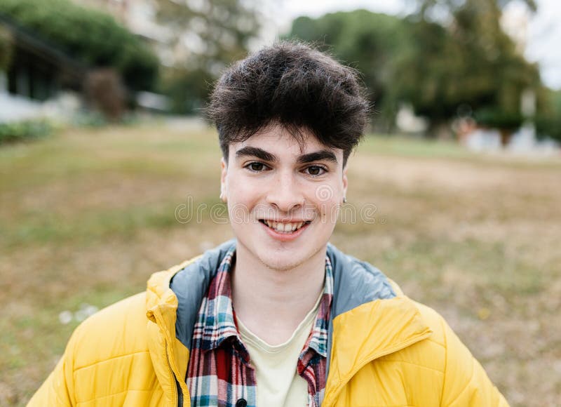 Young Smiling Student Boy Looking at Camera Standing at College Campus ...