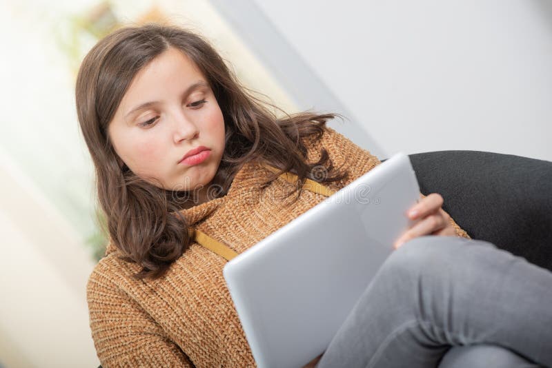Young Smiling Teenager Using a Tablet Computer Stock Image - Image of ...
