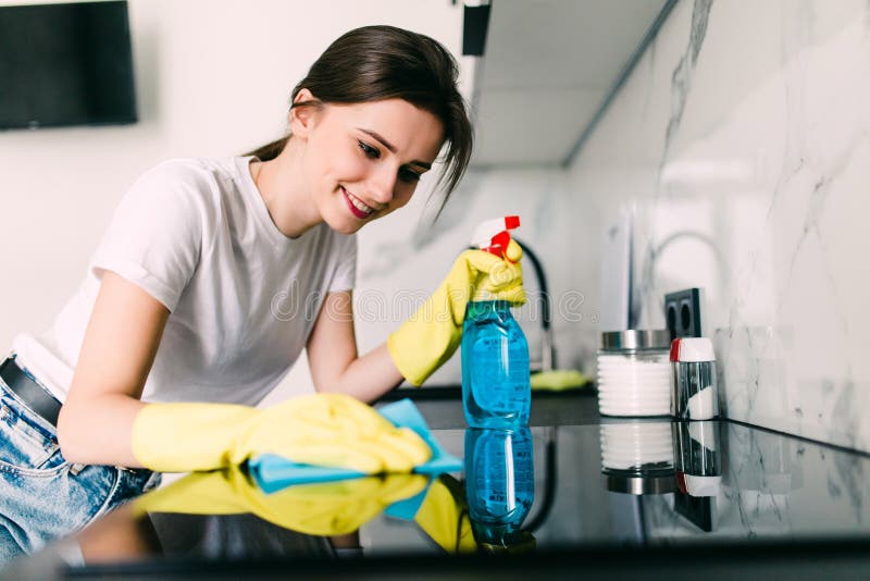 Young Smiling Woman Cleans the Kitchen at Home Stock Image - Image of ...