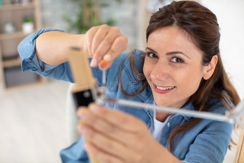 Young Smiling Woman Doing Diy Work at Home Stock Photo - Image of young ...