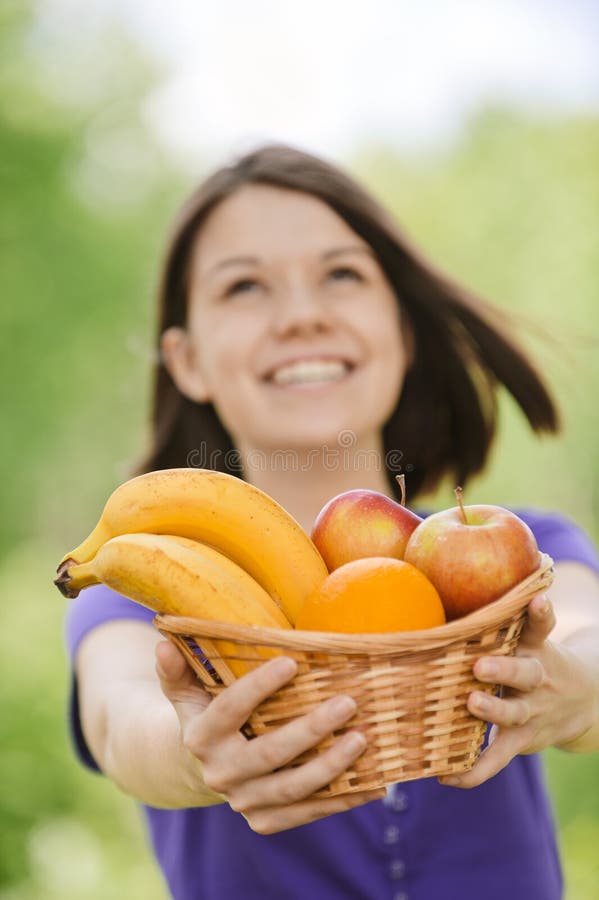 Young Smiling Woman Holding Basket Stock Image - Image of arms ...
