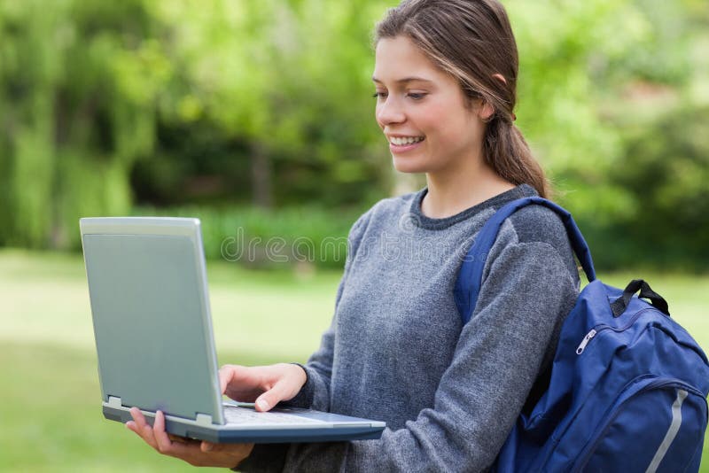 Woman carrying her laptop stock image. Image of elearning - 30452765