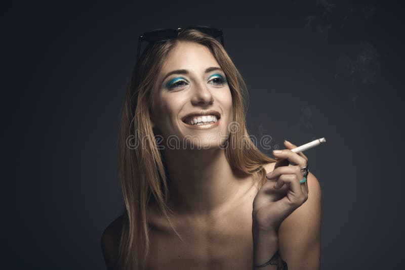 Young Smiling Woman Smoking Cigarette Stock Photo - Image of people ...