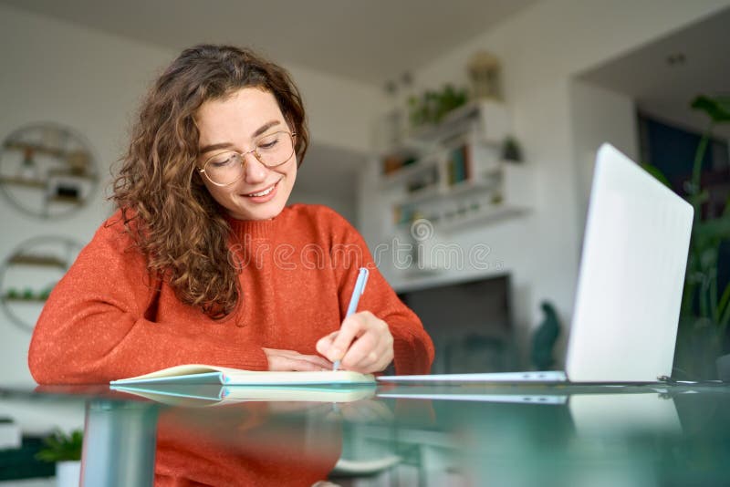 Young Smiling Woman Student Using Laptop Watching Webinar Writing at ...
