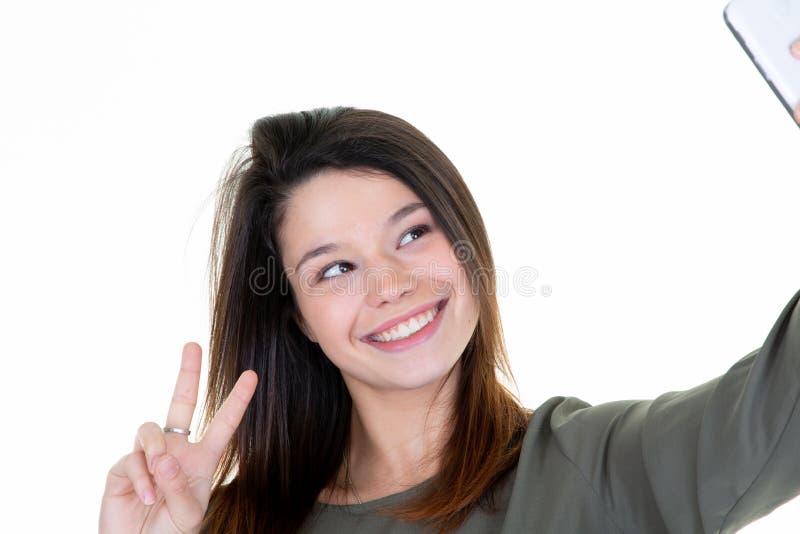 Young Smiling Woman Taking A Selfie With Smartphone Making Peace Sign