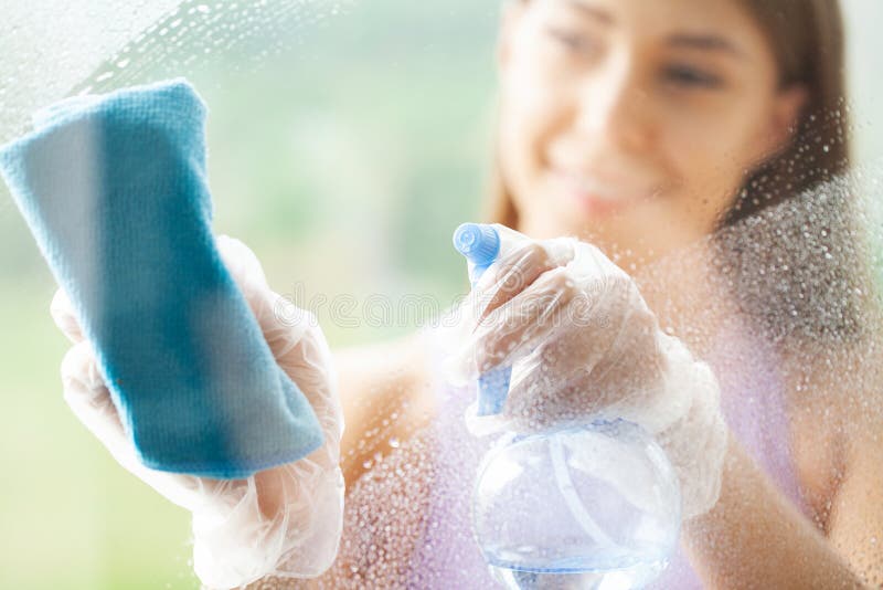 Young Smiling Woman Washing Window with Sponge. Stock Photo - Image of ...