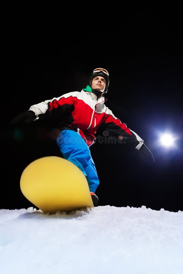 Young Snowboarder Ready To Slide at Night Stock Photo - Image of goal ...