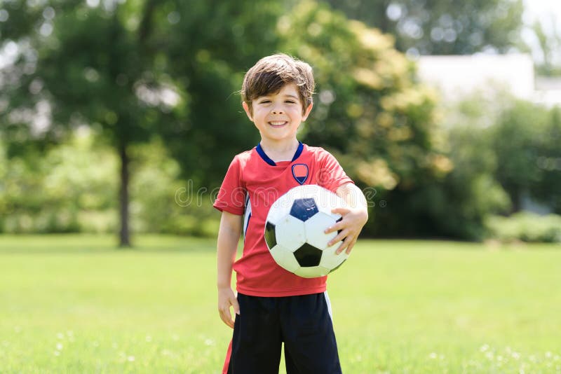 Young Soccer Player Having Fun on a Field with Ball Stock Image - Image ...