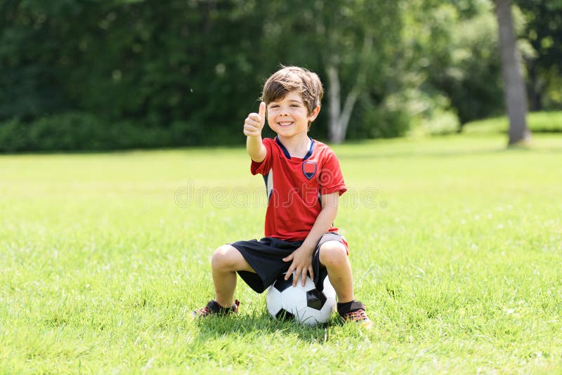Young Soccer Player Having Fun on a Field with Ball Stock Image - Image ...