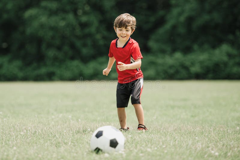 Young Soccer Player Having Fun on a Field with Ball Stock Image - Image ...