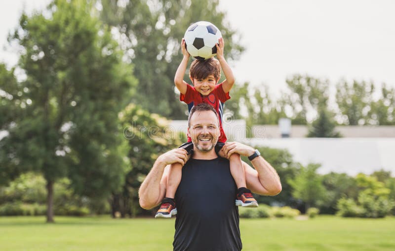 Young Soccer Player Having Fun on a Field with His Father Stock Image ...