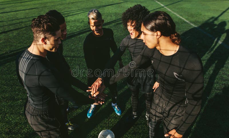 Soccer Team Stacking Hands at Football Field Stock Photo - Image of ...