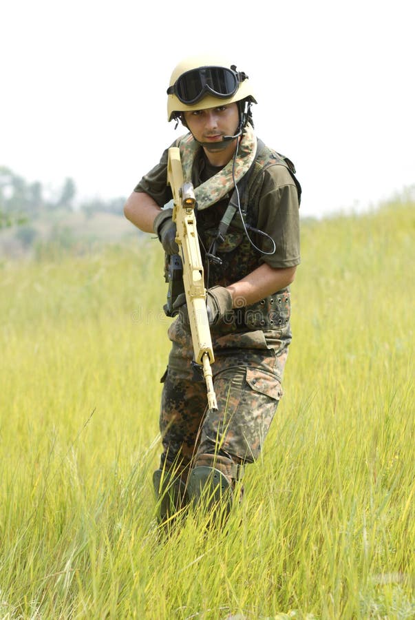 Young Soldier in Helmet with a Gun Stock Image - Image of aiming ...