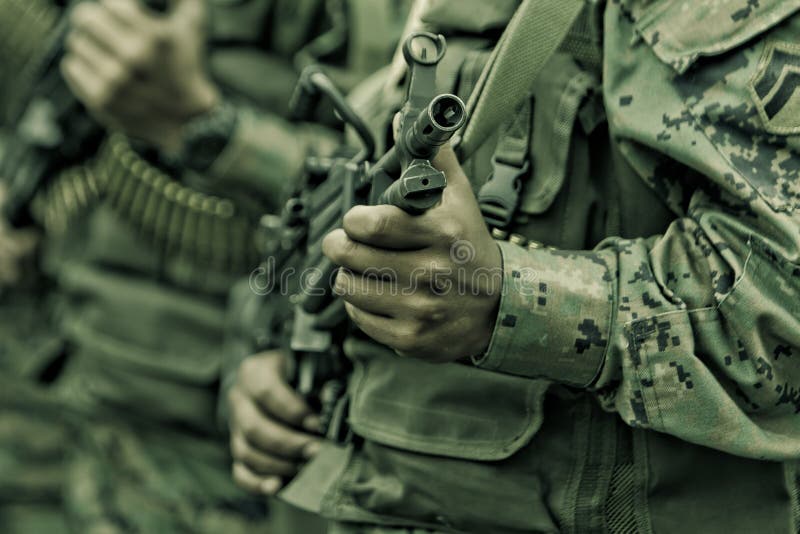 Young soldiers with guns stock photo. Image of power - 27650158