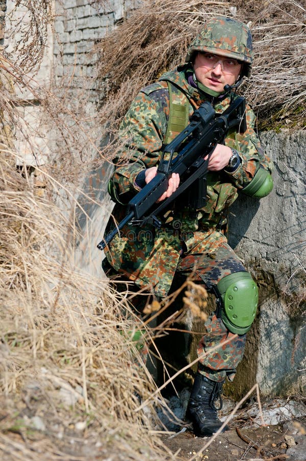 Heavy Armed Soldier stock image. Image of male, combat - 25024499