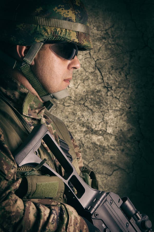 Young soldiers with guns stock photo. Image of power - 46162970