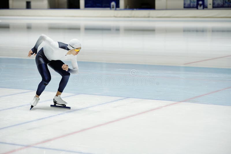 Young Speed Skater Bending Forwards while Exercising on Ice Rink Stock ...