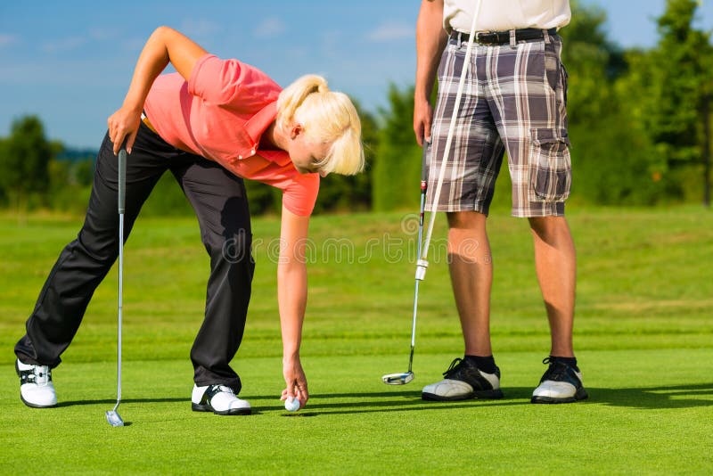 Young Sportive Couple Playing Golf on a Course Stock Image - Image of ...