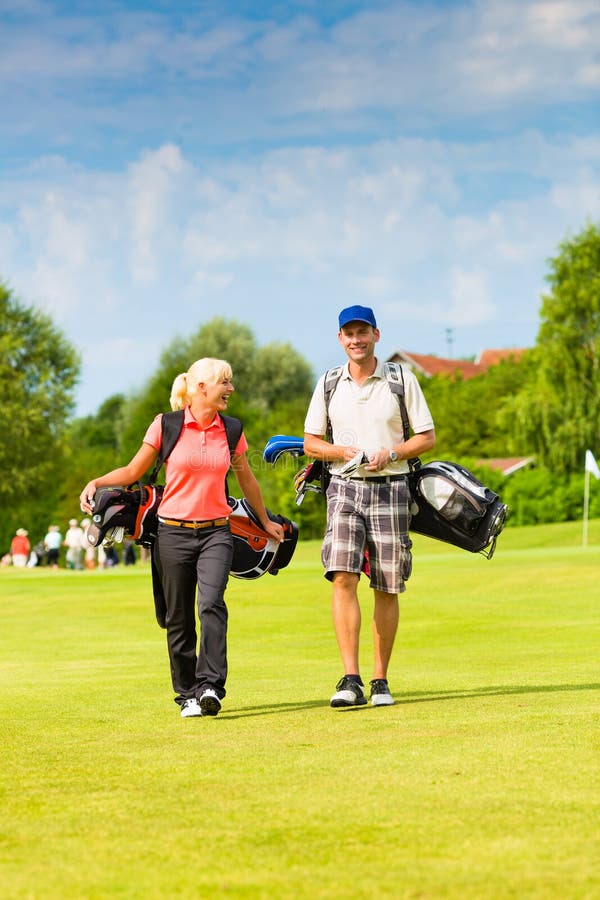 Young Sportive Couple Playing Golf on a Course Stock Photo - Image of ...