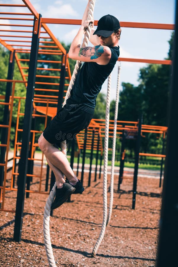Man doing rope exercise stock image. Image of people - 102009687