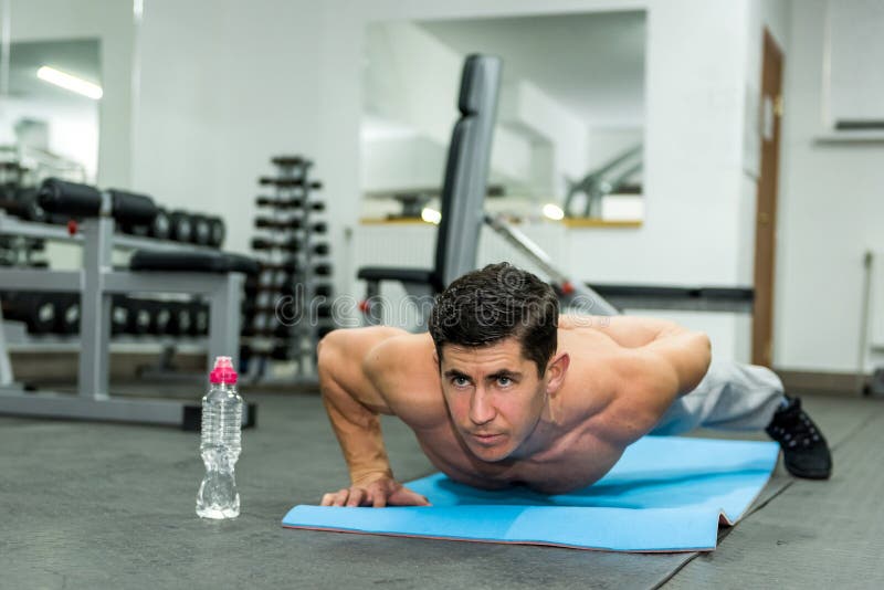 Young and Sportive Man Doing Plank Exercise in Gym Stock Image - Image ...