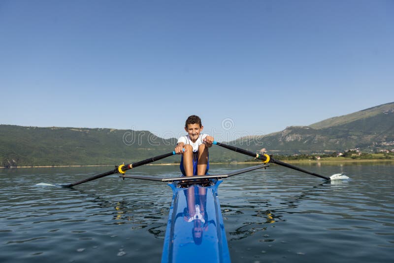 The Young Sportsman is Rowing on the Racing Kayak Stock Image - Image ...