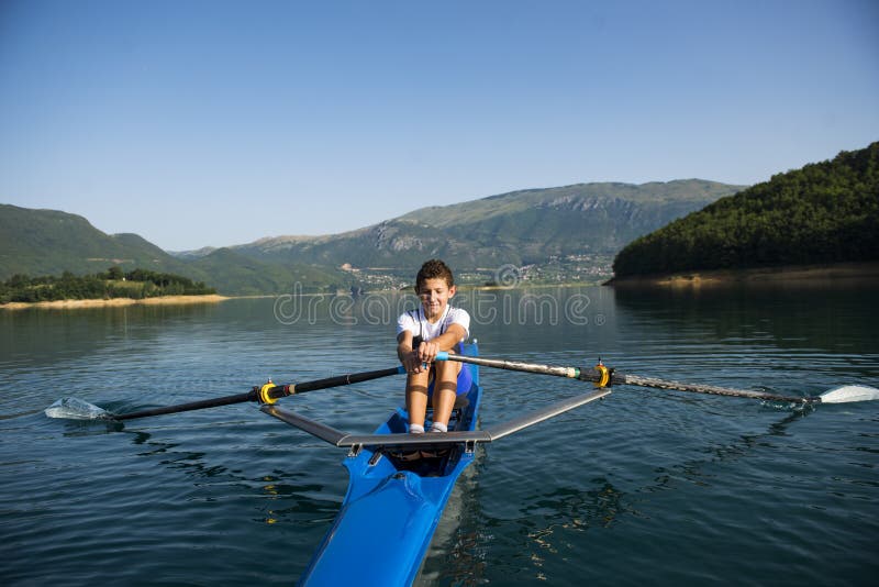 The Young Sportsman is Rowing on the Racing Kayak Stock Image - Image ...