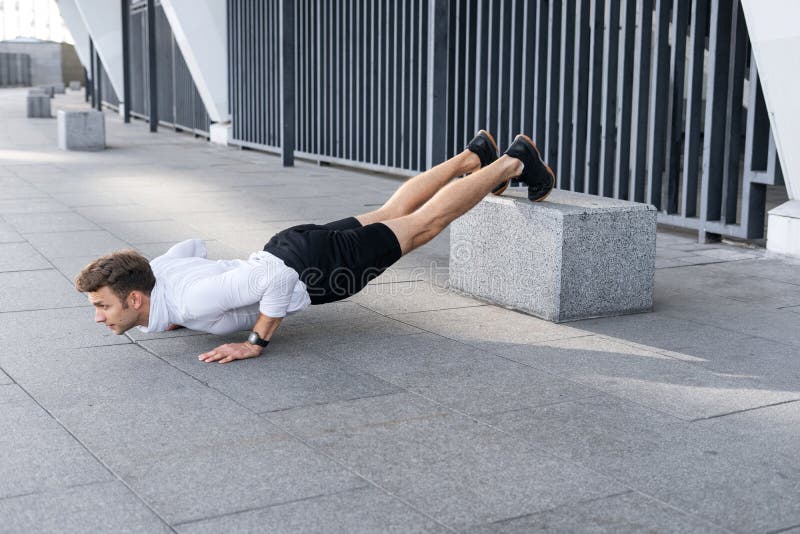 Young Sportsman Standing in Low Plank Pose, Training Outdoors Stock ...
