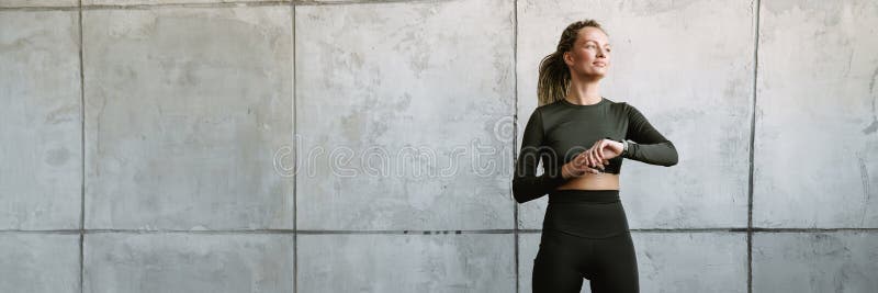 Young Sportswoman with Prosthesis Doing Exercise while Working Out ...
