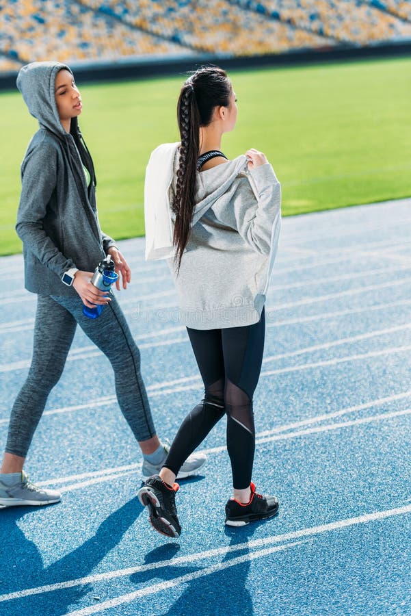 Young Sportswomen Walking Together on Running Track Stadium Stock Photo ...