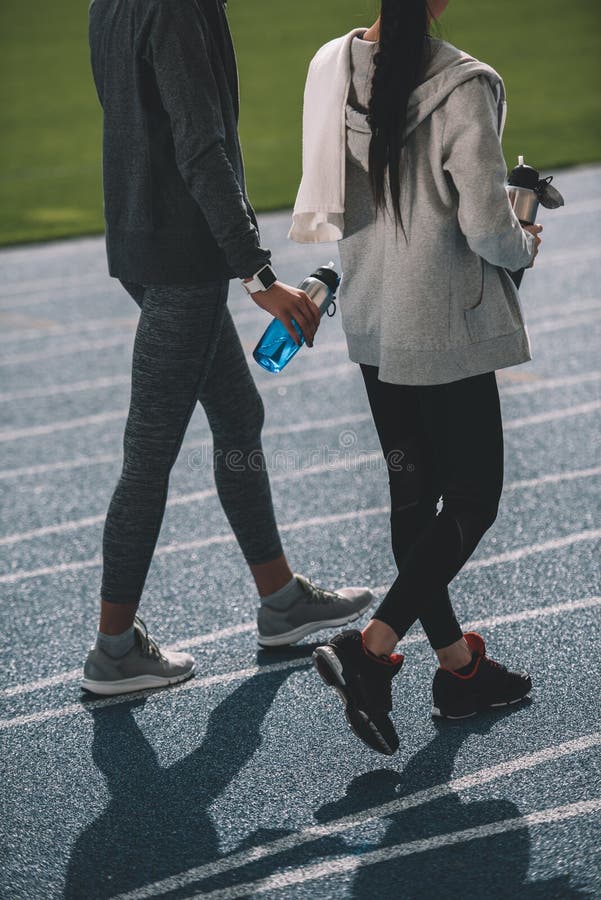 Young Sportswomen Walking Together on Running Track Stadium Stock Image ...