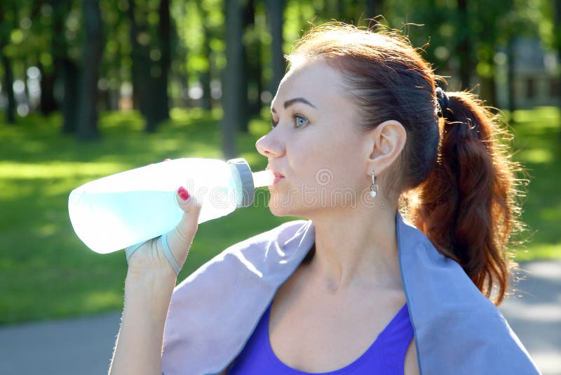 Young Sporty Girl Drinking Water from a Bottle Stock Photo - Image of ... Young Sporty Girl Drinking Water from a Bottle Stock Photo - Image of ...