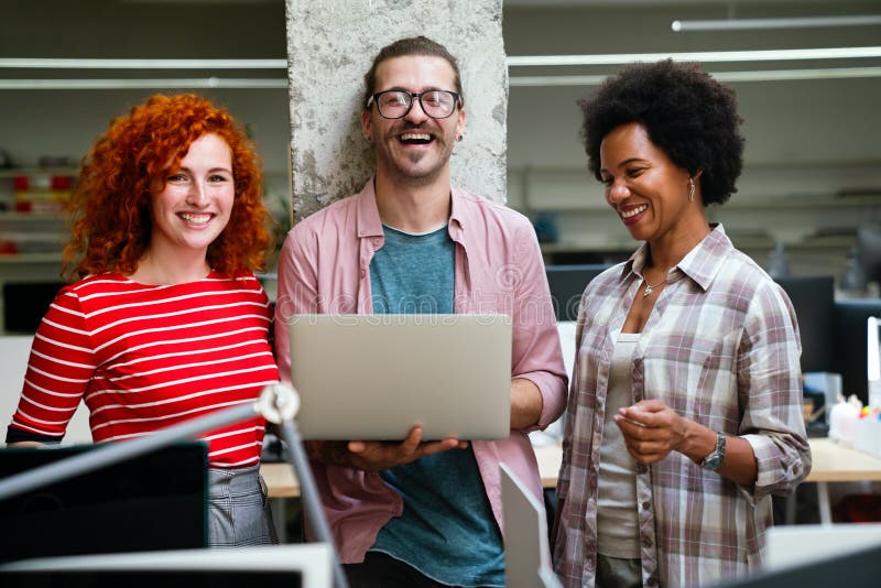 Young Startup Business People Having Fun, Working and Chatting at ...