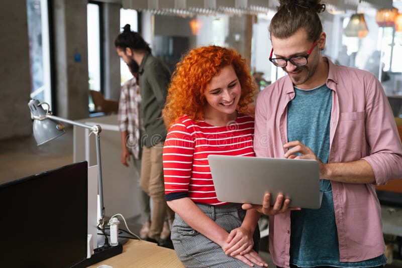 Young Startup Business People Having Fun, Working and Chatting at ...