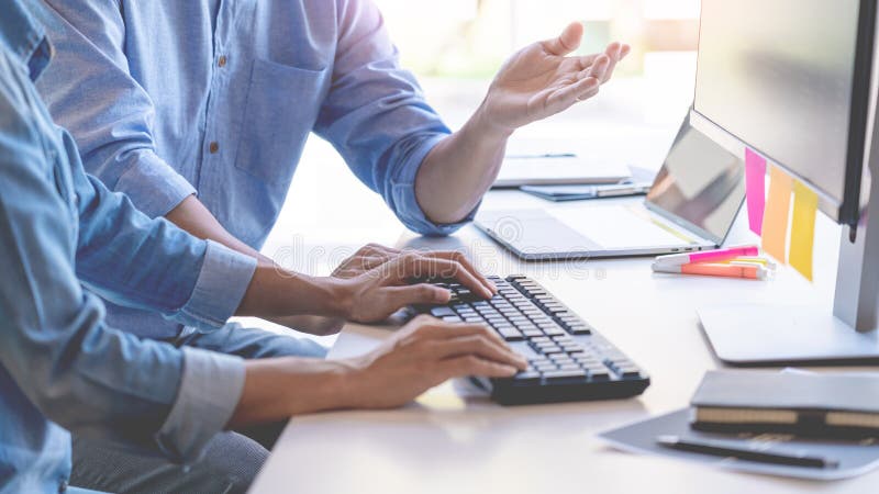 Young Startup Programmers Sitting at Desks Working on Computers Screen for Developing ...