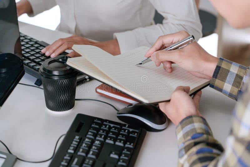 Young Startup Programmers Sitting at Desks Working on Computers Screen ...