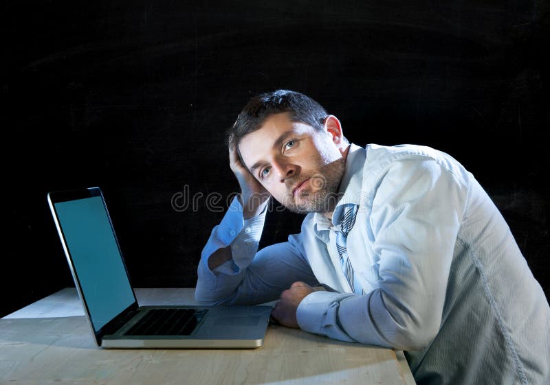Young Stressed Businessman Working on Desk with Computer Laptop in ...