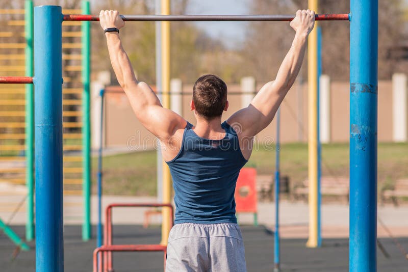 Young Strong Guy Pulls Himself Up Stock Image - Image of athletic ...