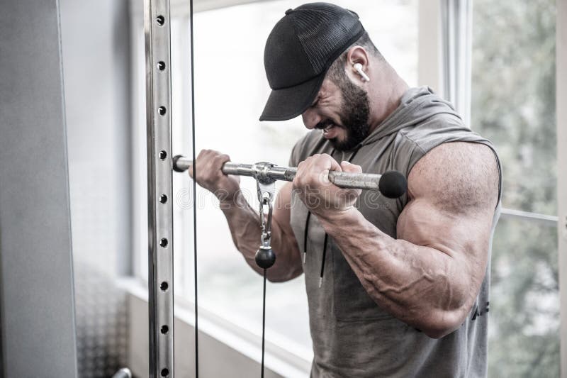 Young Strong Man with Beard Making Heavy Weight Exercise in Sport Gym ...