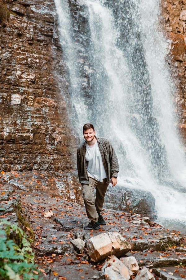 Young Strong Man Hiker Looking the Waterfall Stock Photo - Image of ...