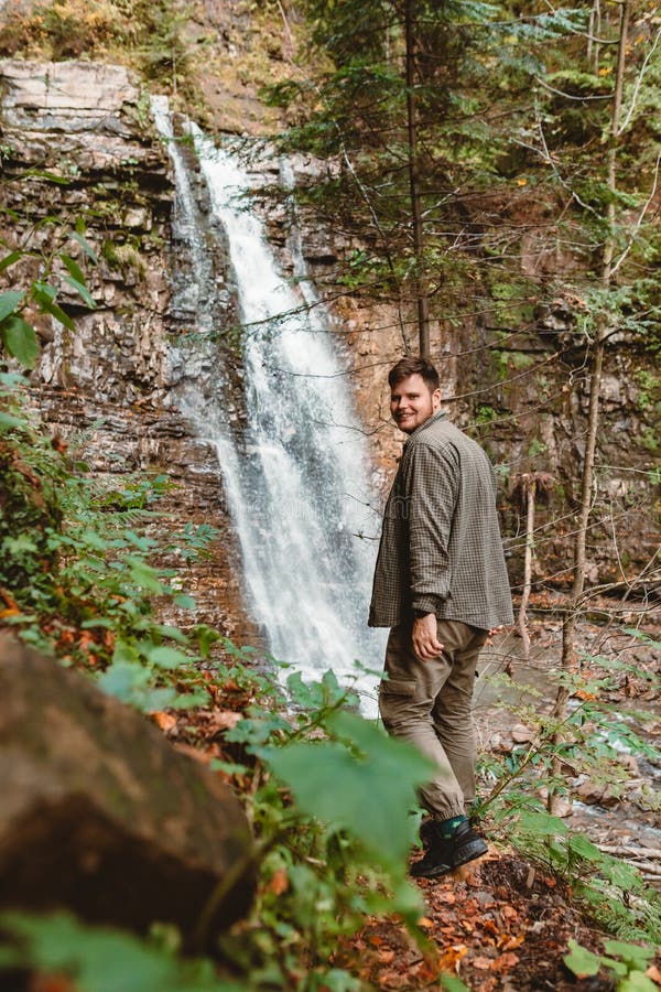 Young Strong Man Hiker Looking the Waterfall Stock Photo - Image of ...