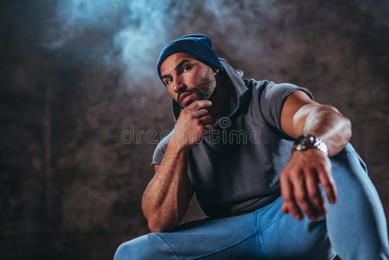 Young Strong Man Posing in Dark Interior Stock Image - Image of model ...
