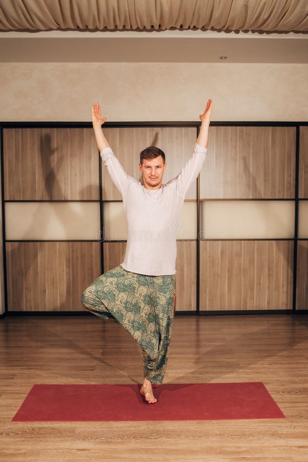 Young Strong Man in the Tree Pose Stock Image - Image of asana, balance ...