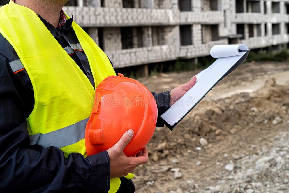 Young Strong Workers in Special Uniforms Compare Construction Work with ...