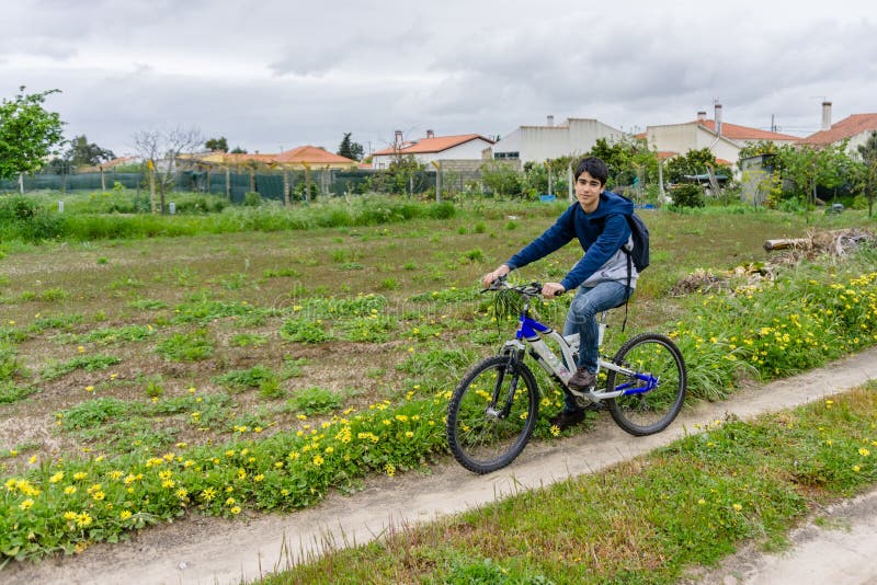 Young Student with Backpack and Bicycle. Go To School Stock Photo ...