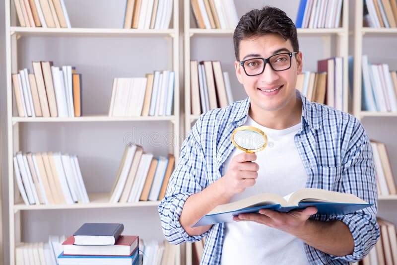 The Young Student with Books Preparing for Exams Stock Image - Image of ...