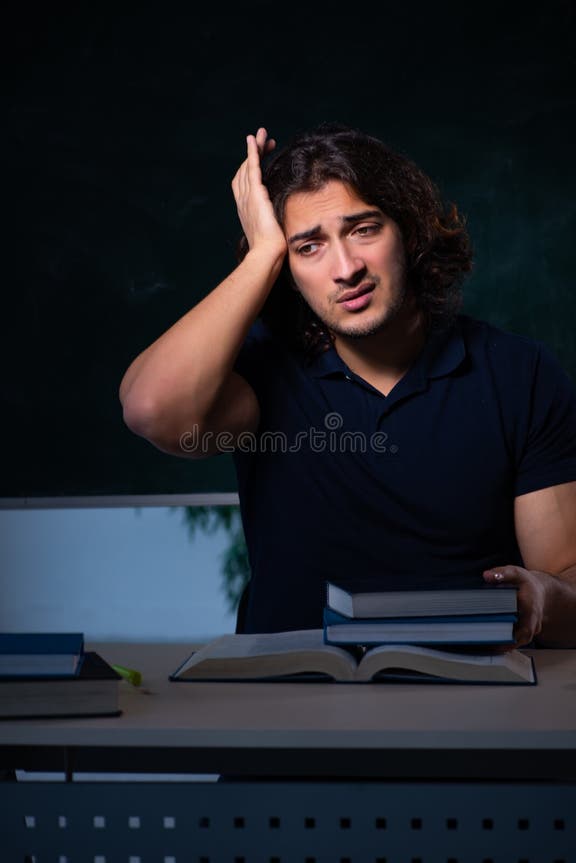 Young Male Student in the Classroom at Night Stock Photo - Image of ...