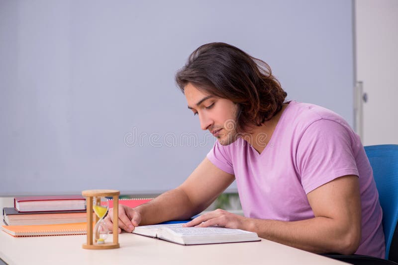Young Male Student in the Classroom at Time Management Concept Stock ...