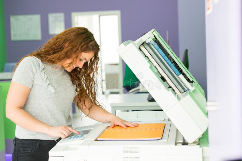 Young Student at a Copy Center Stock Image - Image of page, hand: 122366627